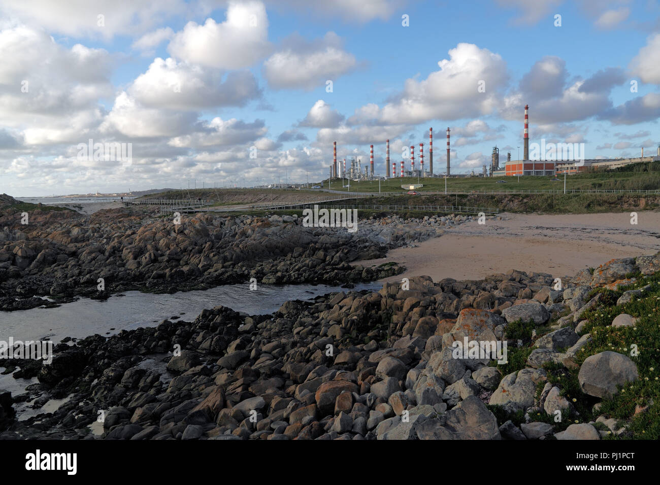Big oil refinery and powerplant near a beach Stock Photo - Alamy