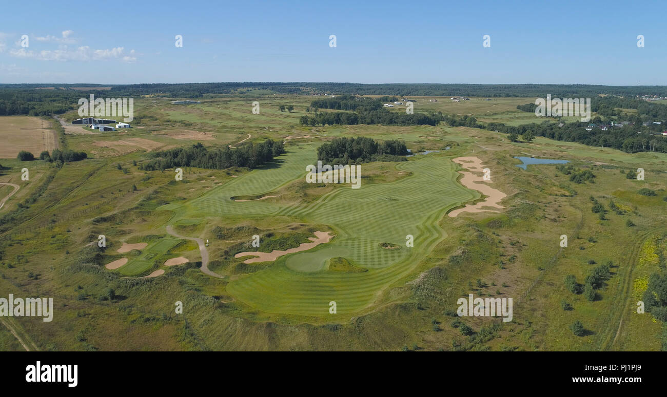 Aerial view Golf course with green grass and ponds. Golf field in the ...