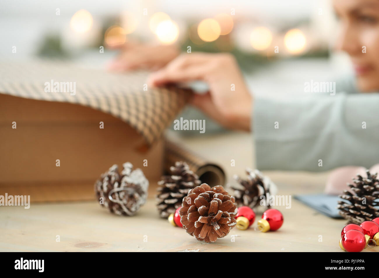Christmas presents. Gift wrapping process Stock Photo - Alamy