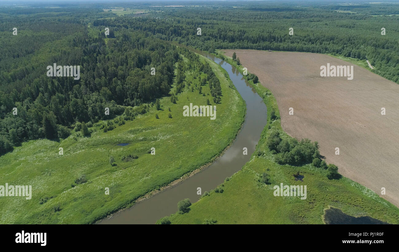 Aerial view summer landscape, river among trees, farmlands. Countryside ...