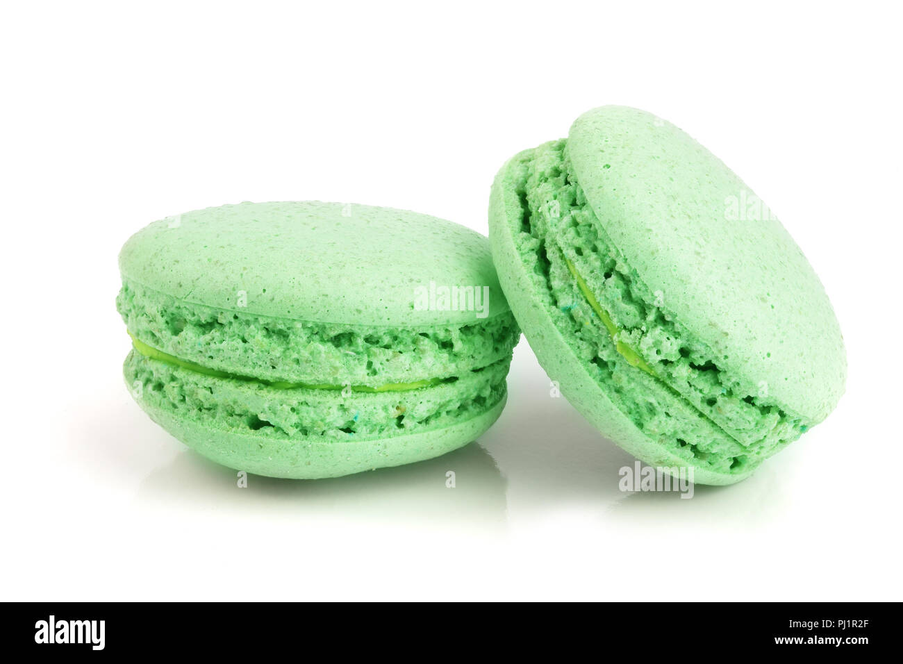 green macaron isolated on white background closeup Stock Photo - Alamy