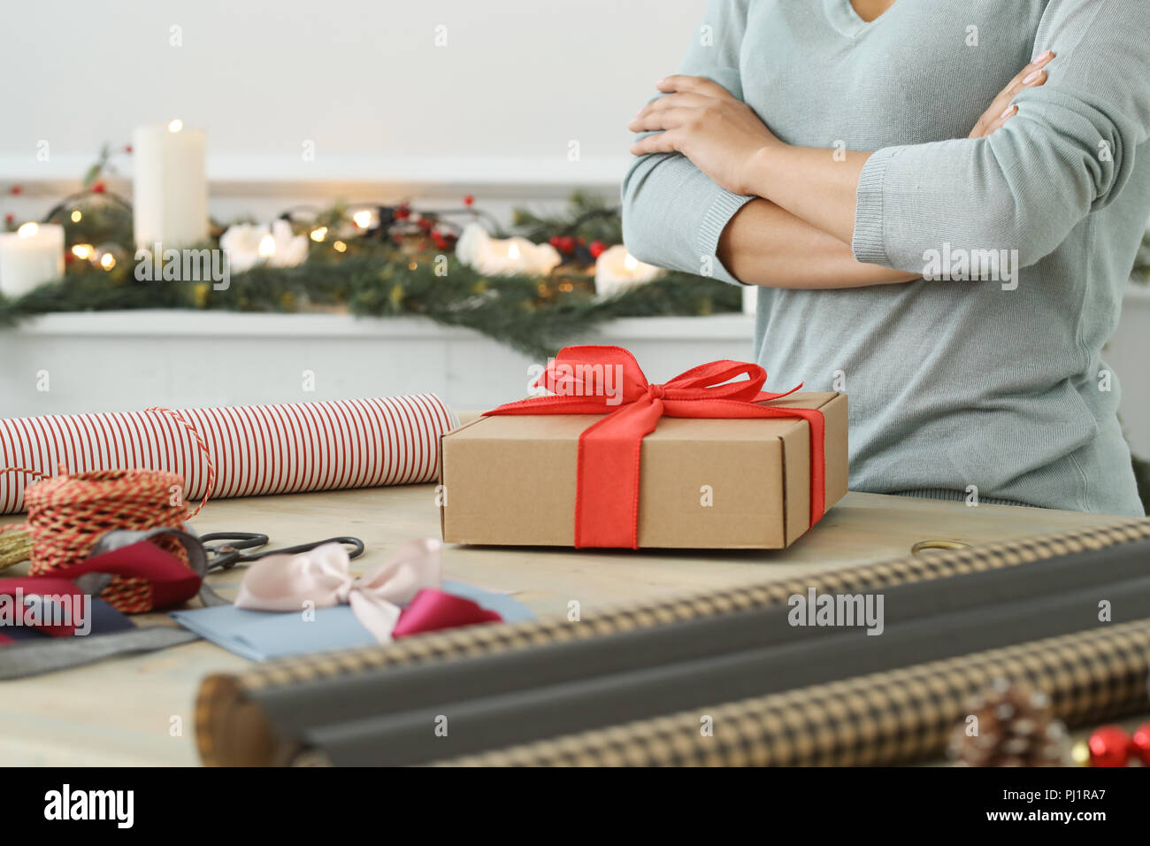 Christmas presents. Gift wrapping process Stock Photo - Alamy