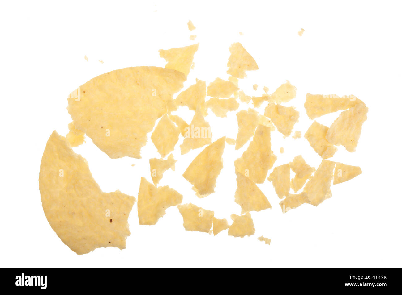 Potato chips crumbs and leftovers isolated over the white background ...