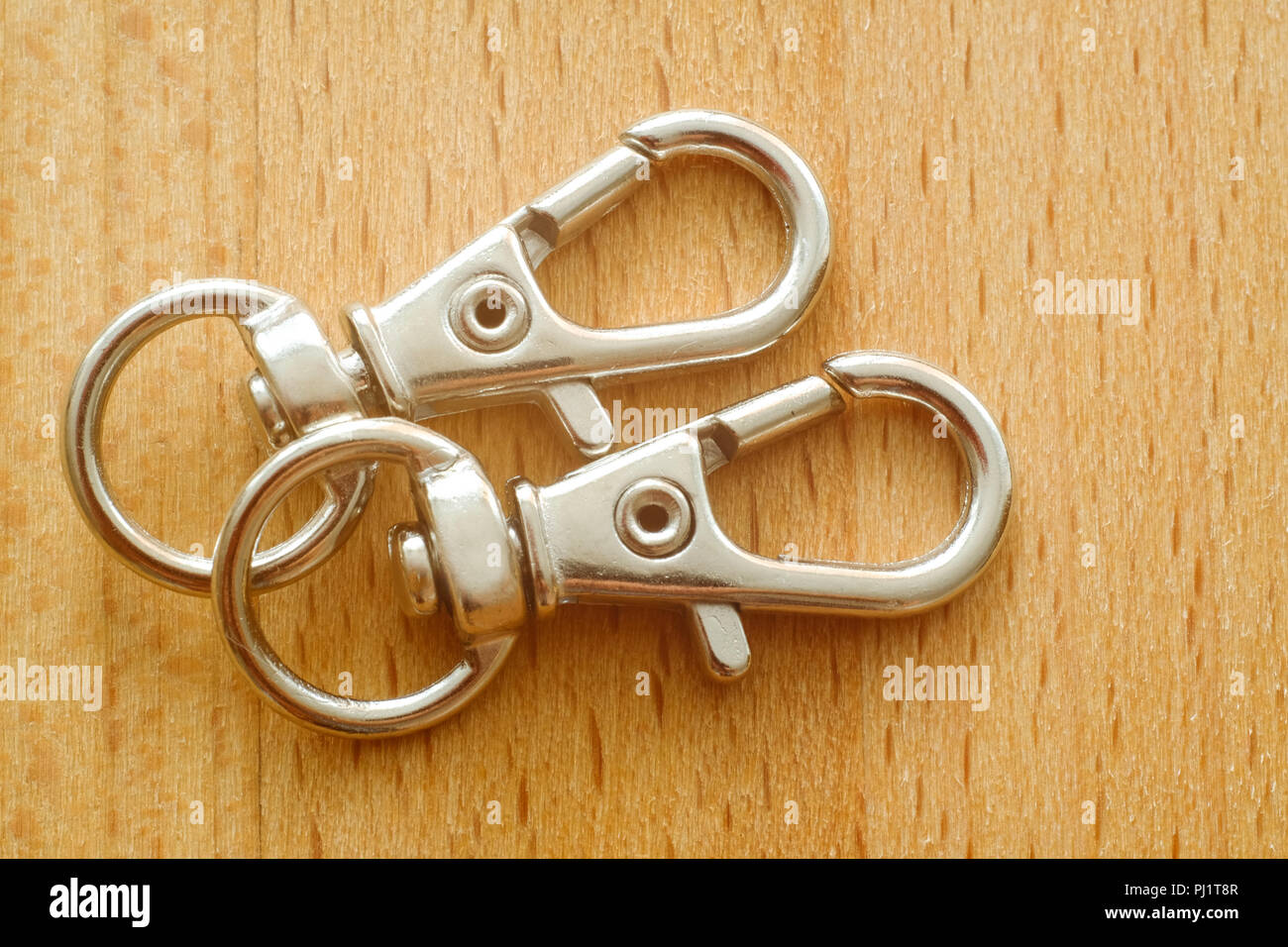 Carabiner for keys. Keychain with ring on wooden surface Stock Photo ...