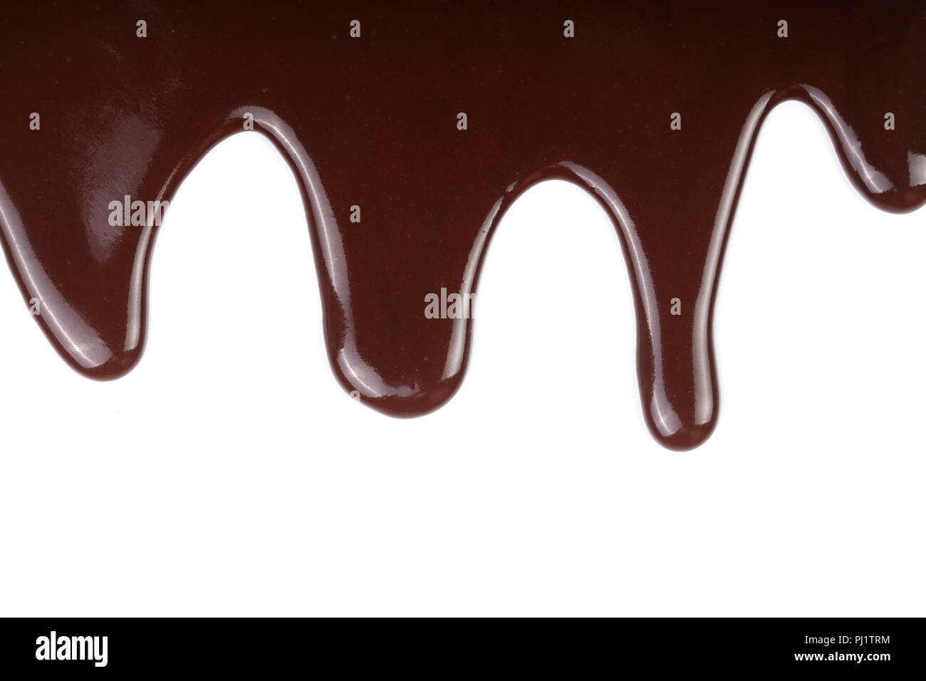 Melted chocolate dripping isolated on white background Stock Photo - Alamy
