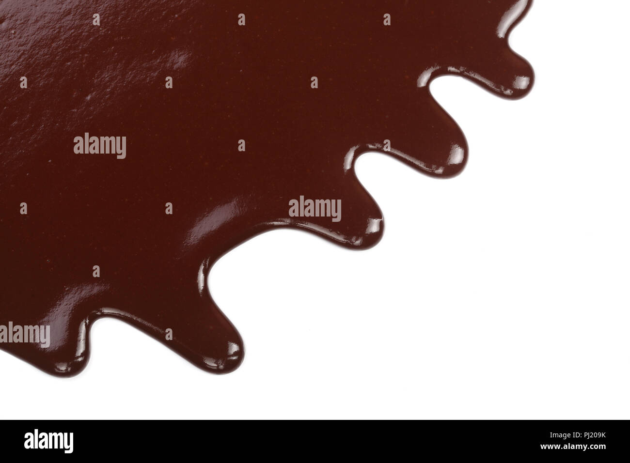 Melted chocolate dripping isolated on white background Stock Photo - Alamy