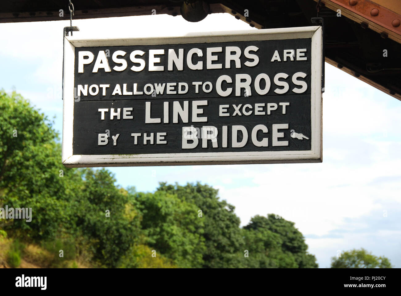 Close up view of an original station sign explaining passengers are not ...