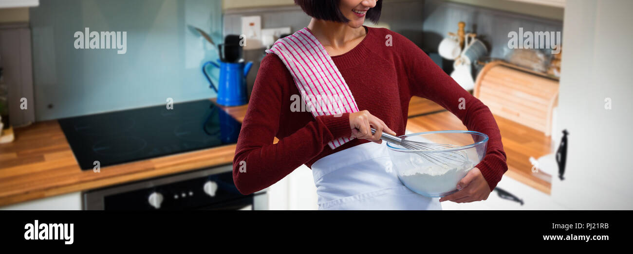 Composite image of female chef mixing flour in bowl with whisk Stock ...