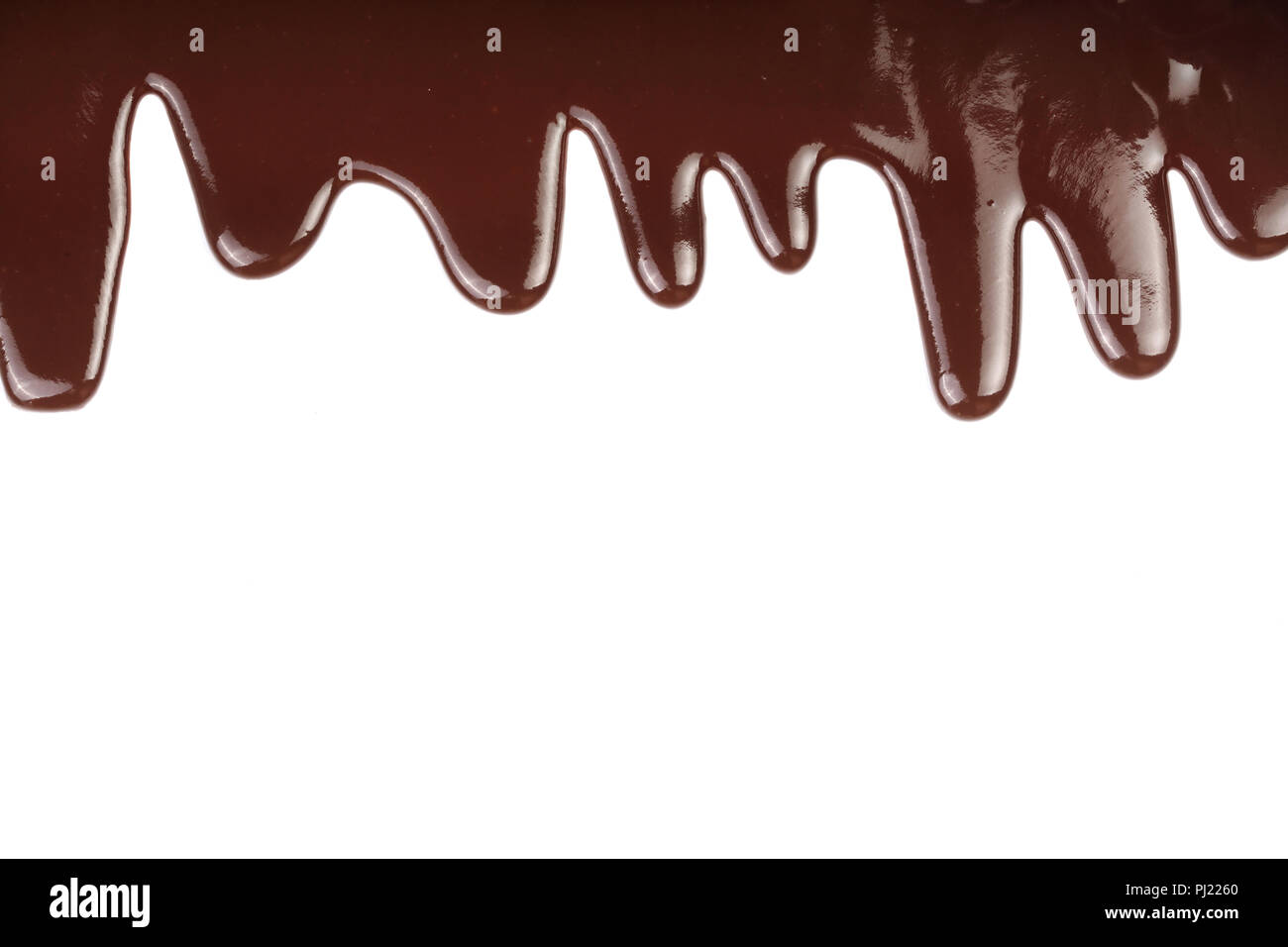 Melted chocolate dripping isolated on white background Stock Photo - Alamy