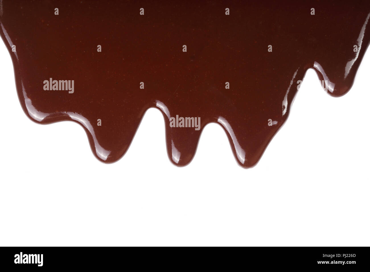Melted chocolate dripping isolated on white background Stock Photo - Alamy