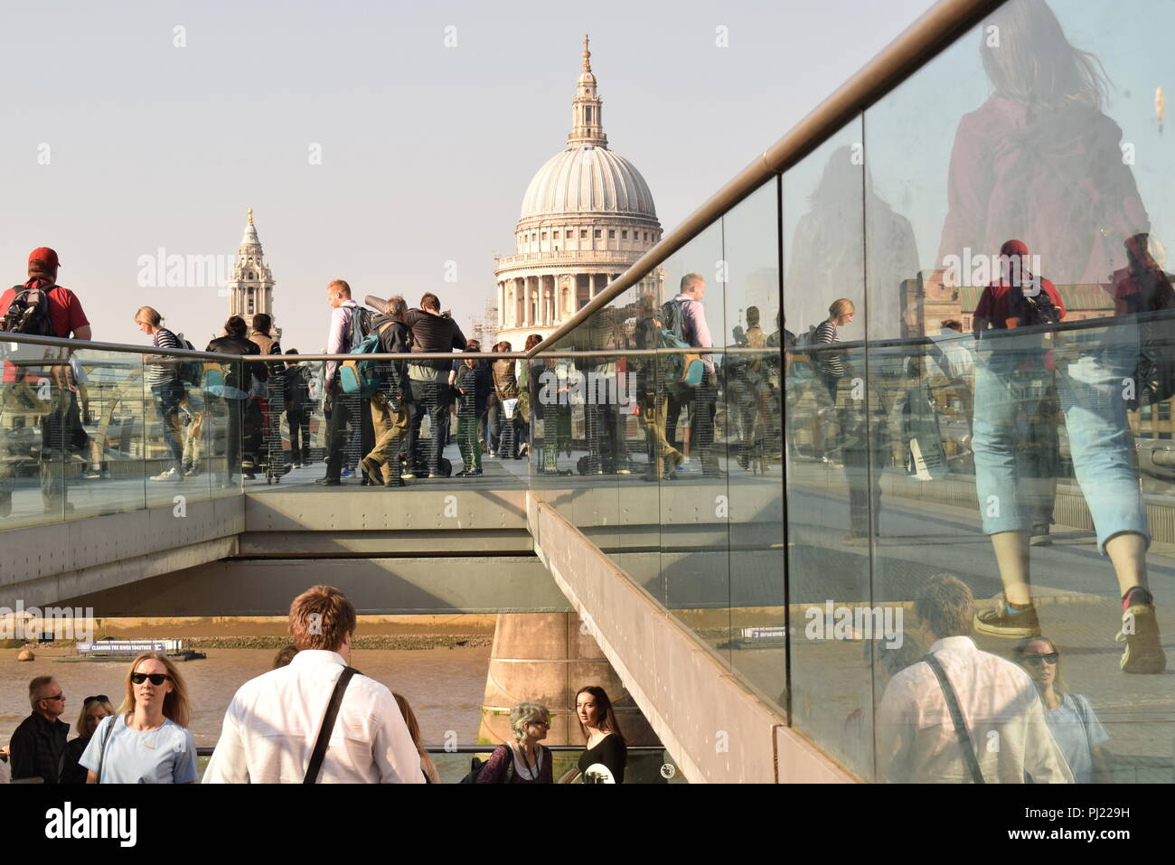 A picture of People Walking on the Millenium Bridge Stock Photo - Alamy
