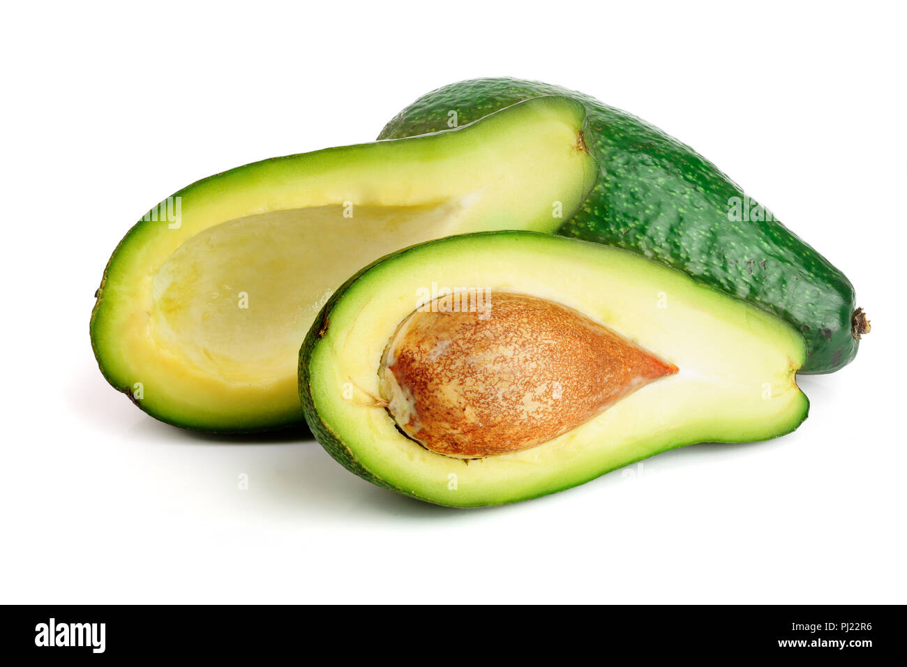 avocado and half isolated on white background close-up Stock Photo - Alamy