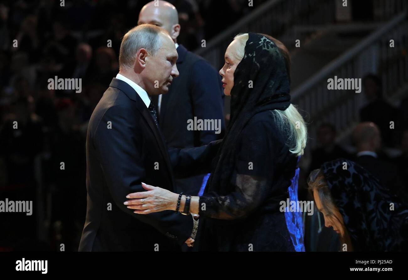 Russian President Vladimir Putin embraces Ninel Kobzon, widow of ...