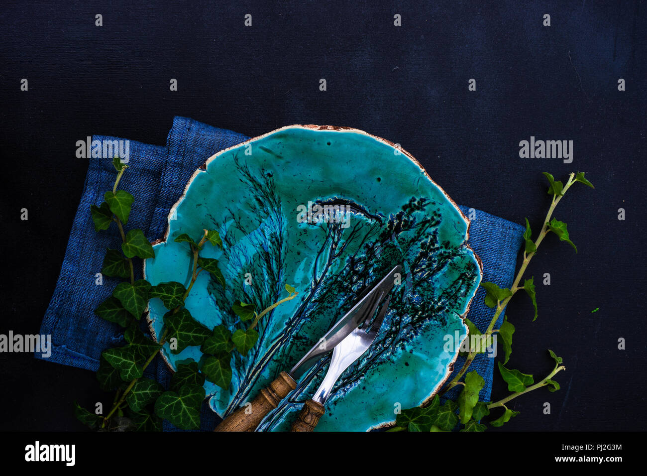 Rustic table setting with ceramic plate and vintage silverware Stock ...