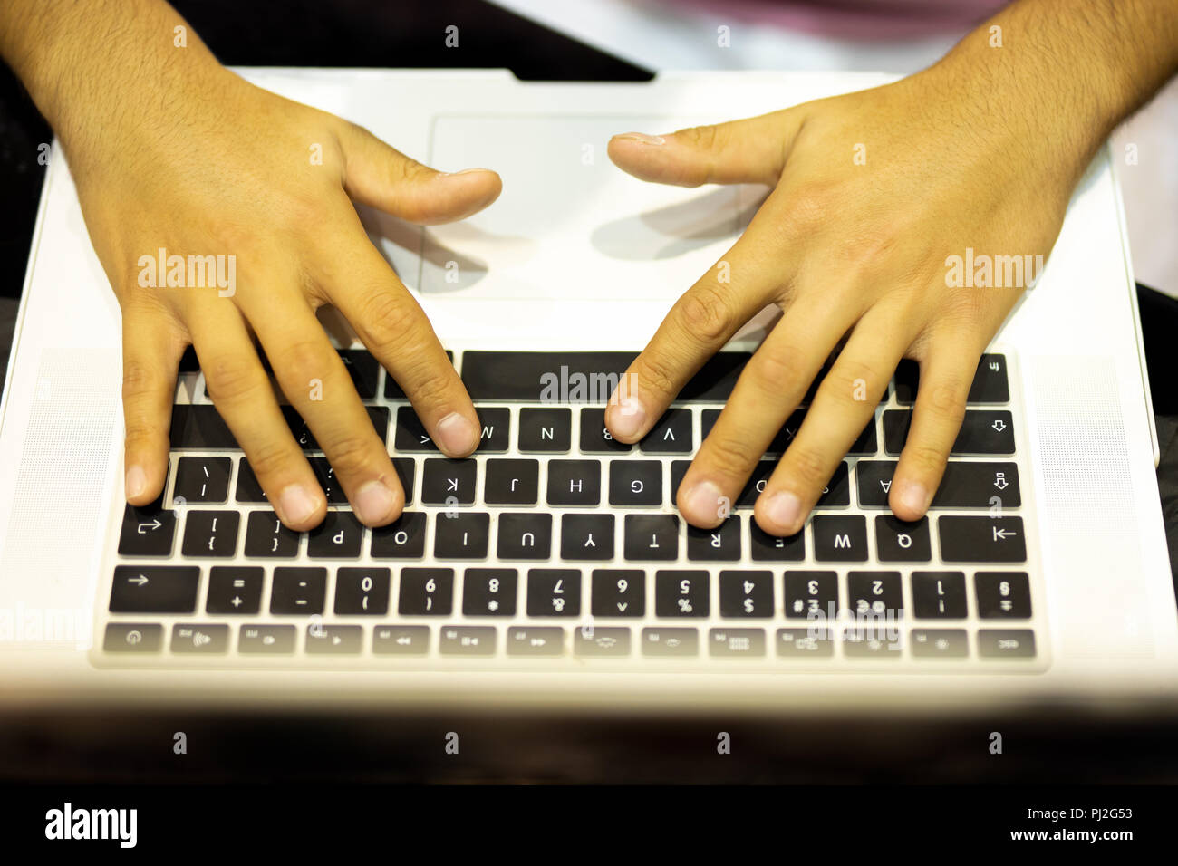 Top view man's hands typing on laptop computer Stock Photo - Alamy