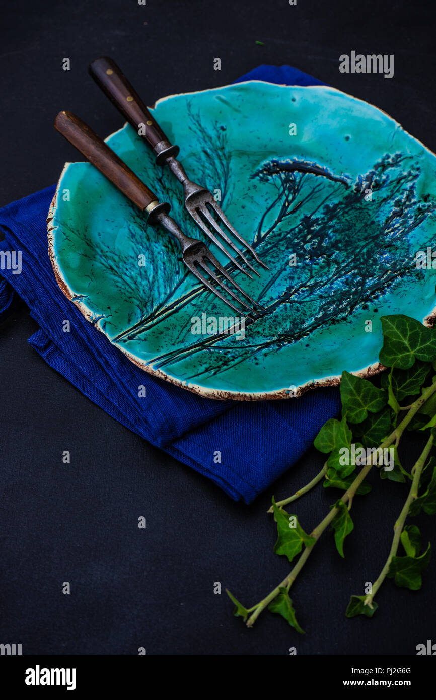 Rustic table setting with ceramic plate and vintage silverware Stock ...