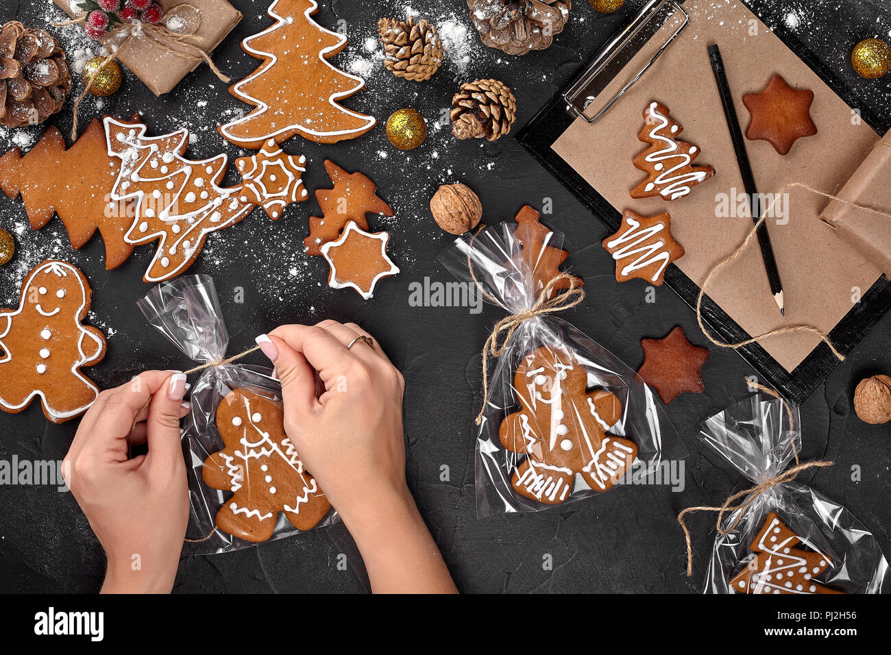 Christmas gift gingerbread on dark background. Biscuits in festive ...