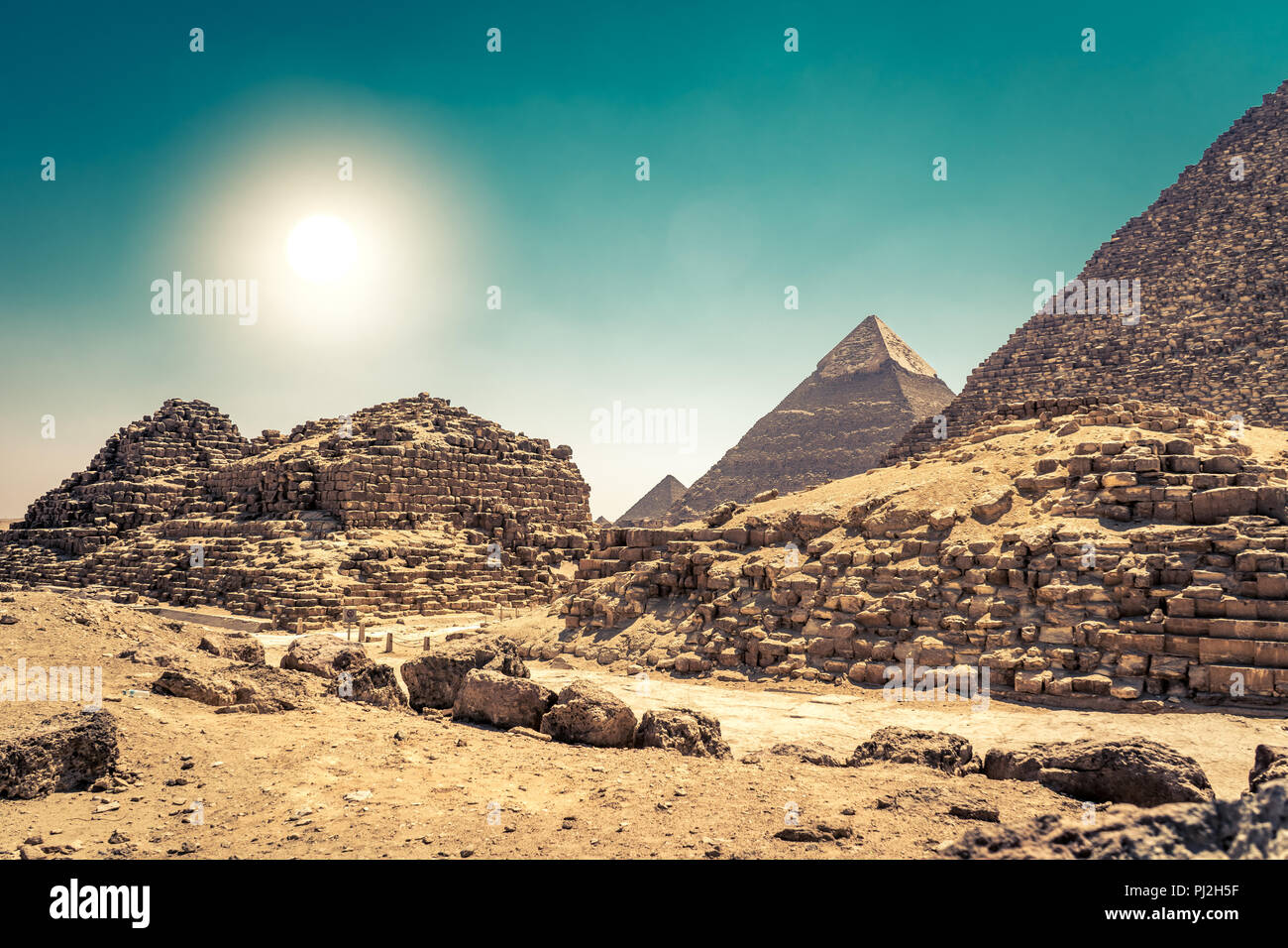 Egyptian pyramids in sand desert and clear sky Stock Photo - Alamy