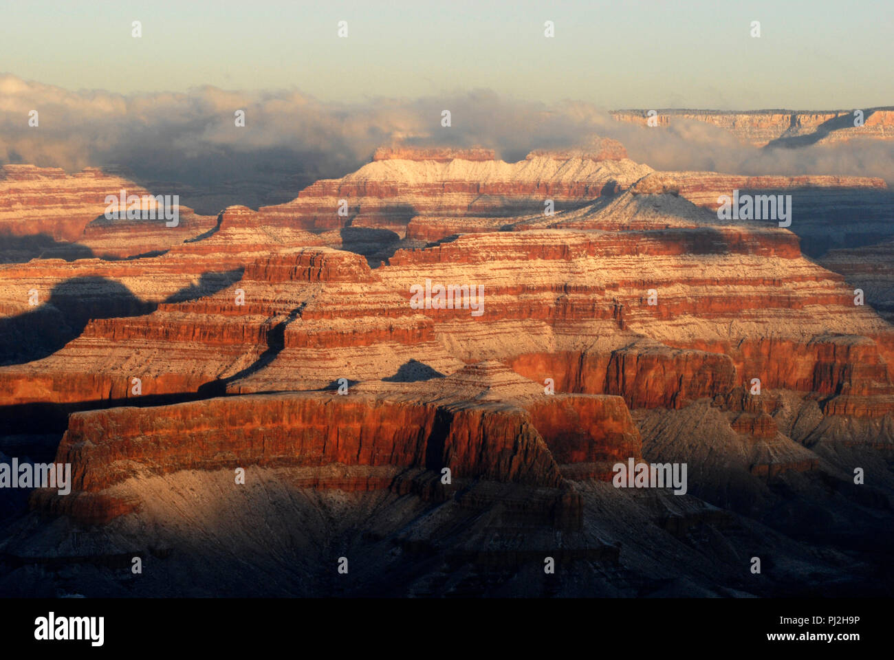 Winter scene showing bands of snow contrasting with colorful layers of ...