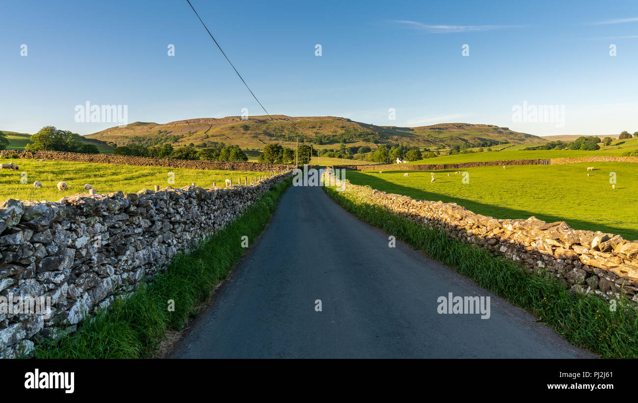 Rural road in the Yorkshire Dales near Austwick, North Yorkshire ...