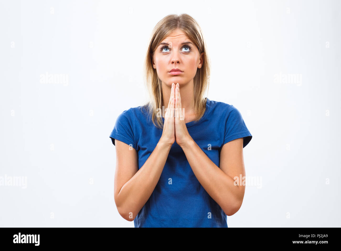 One woman praying looking up hi-res stock photography and images - Alamy