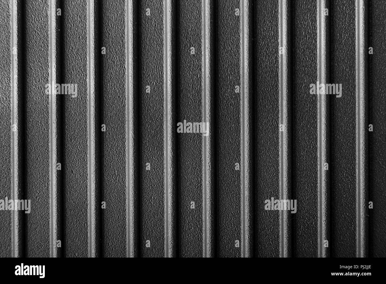 ribbed cast iron surface, metal texture, textured black background ...