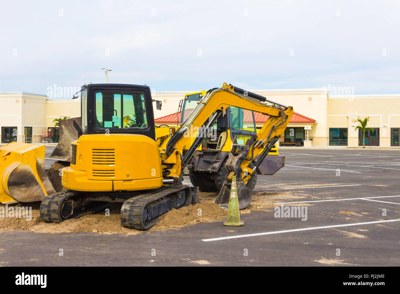 Front end loader dumping stone and sand in a mining quarry Stock Photo ...