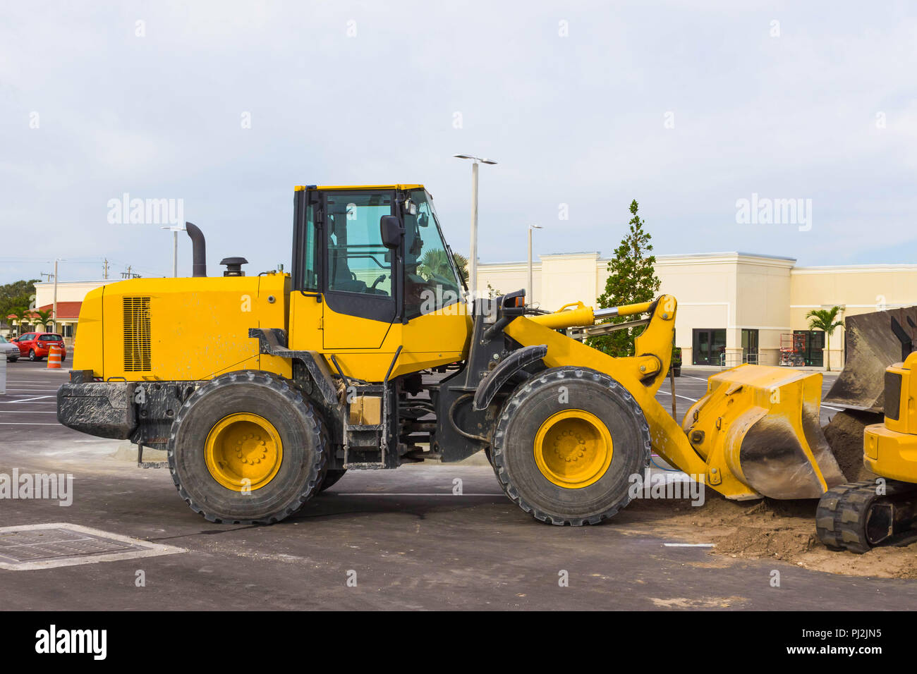 A backhoe and a front end loader hi-res stock photography and images ...