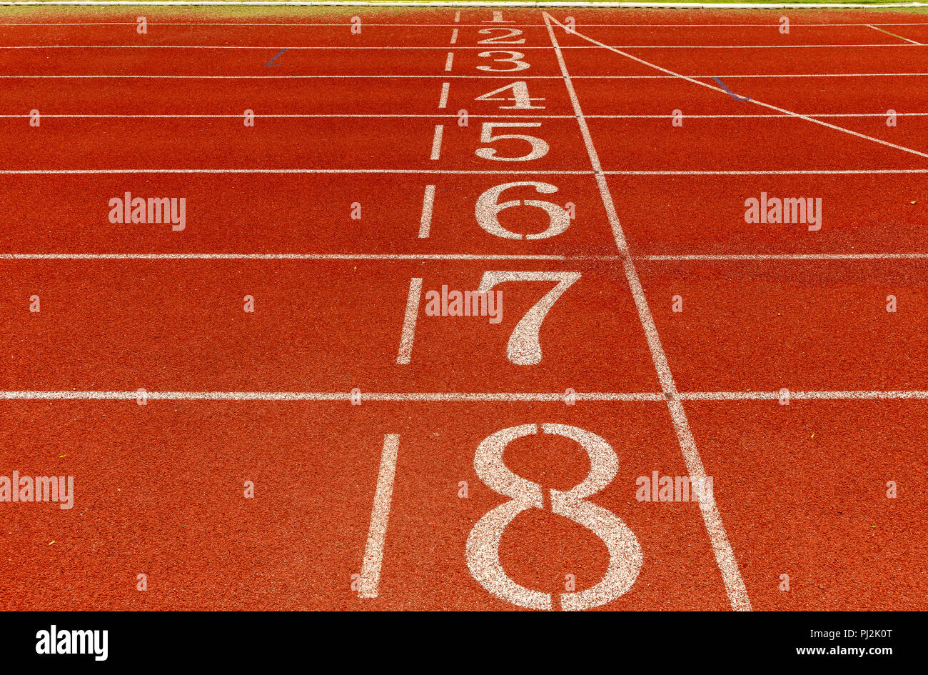 Running track with Number, starting concept Stock Photo - Alamy