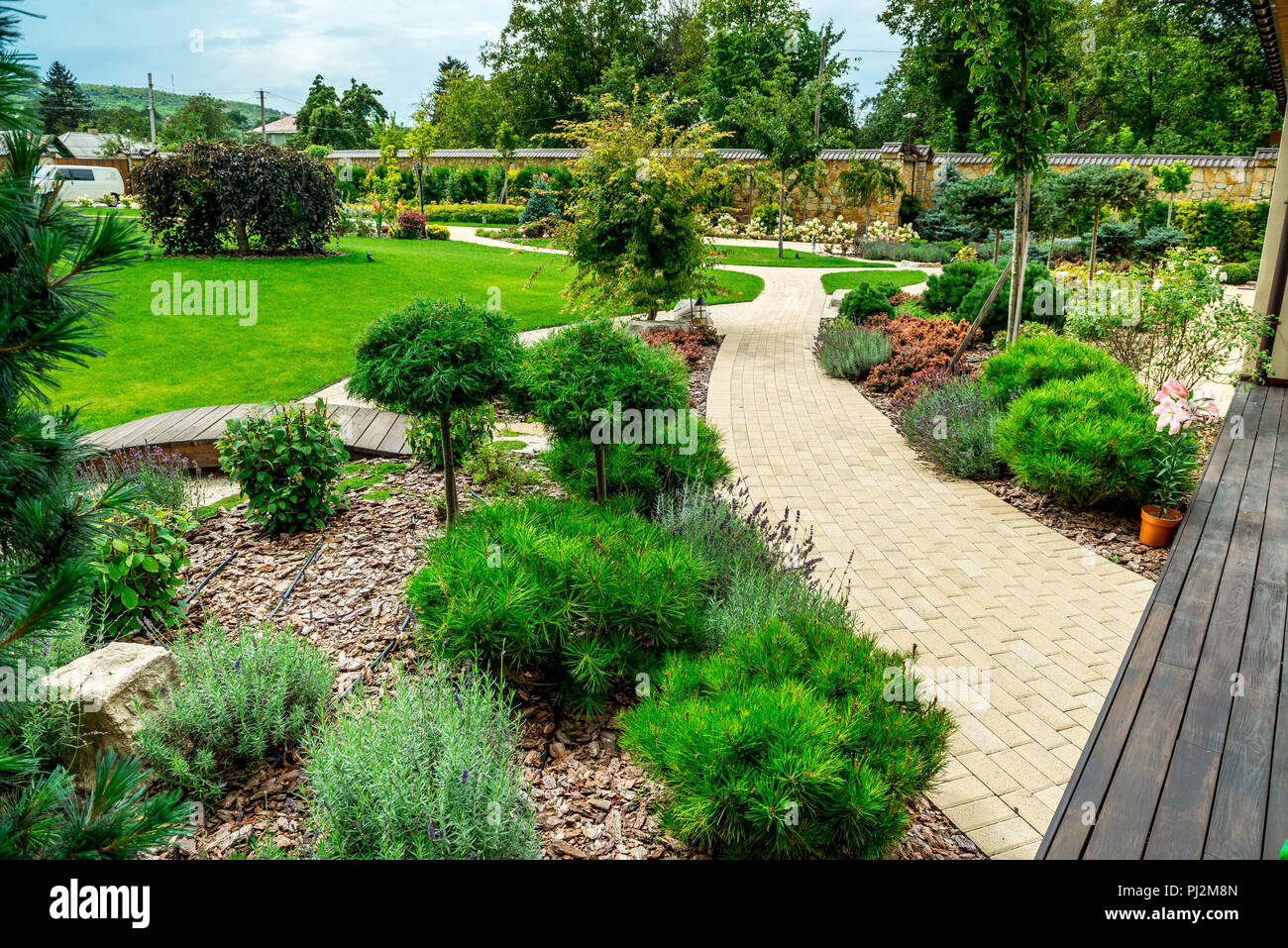 A country house with a beautiful backyard behind the house, landscape ...