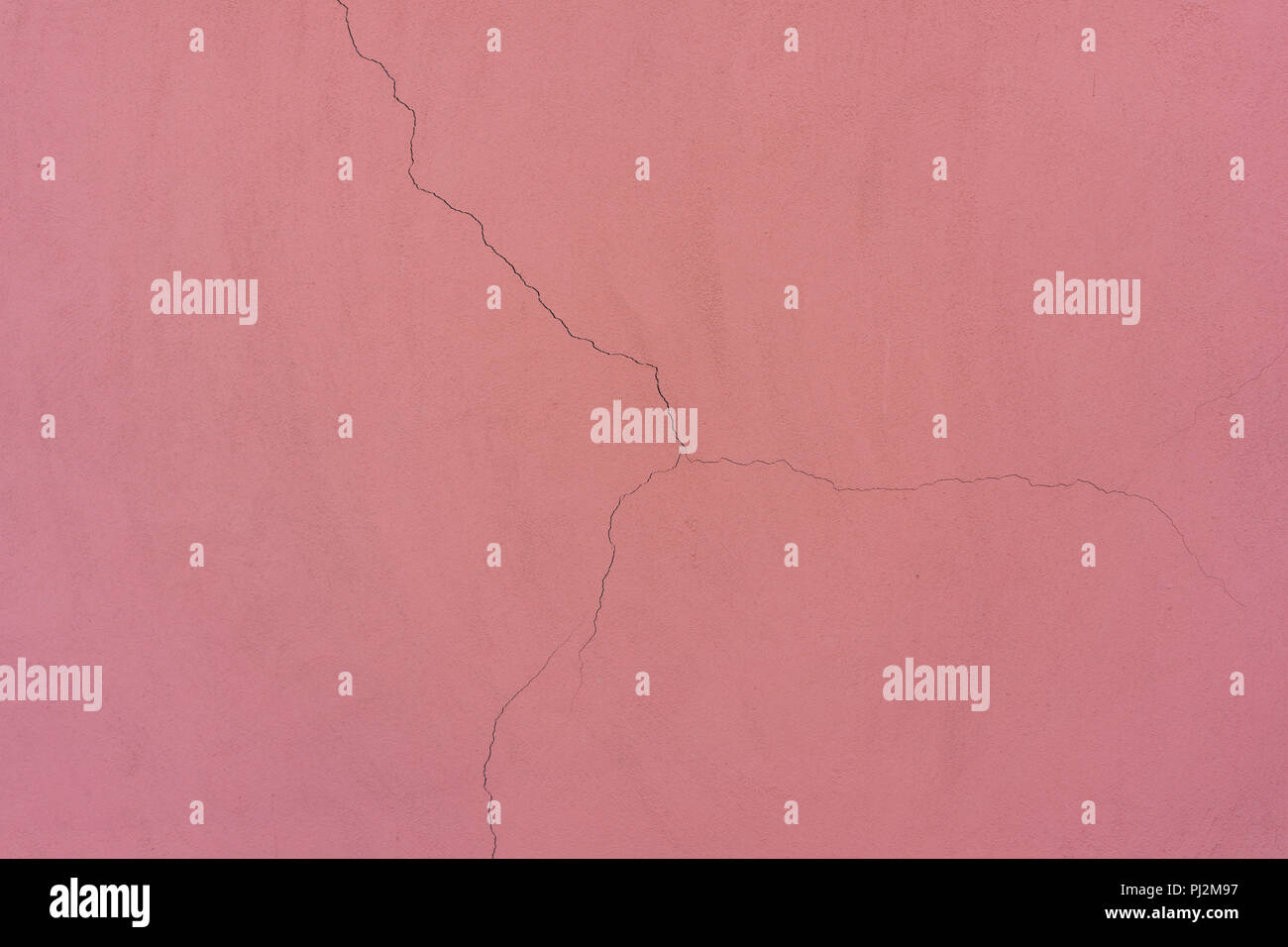 stained red wall with crack pattern design Stock Photo - Alamy