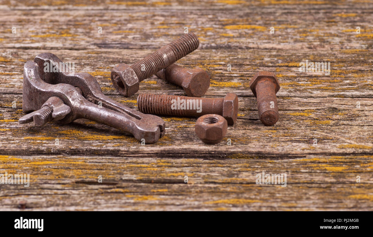 Old rusty nuts, bolts. Ancient tools. A dream of old molded boards ...