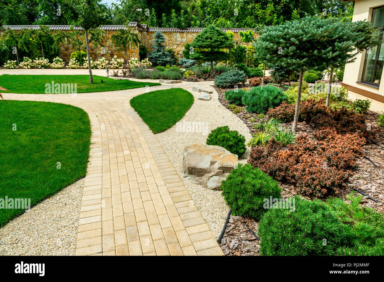 A country house with a beautiful backyard behind the house, landscape ...