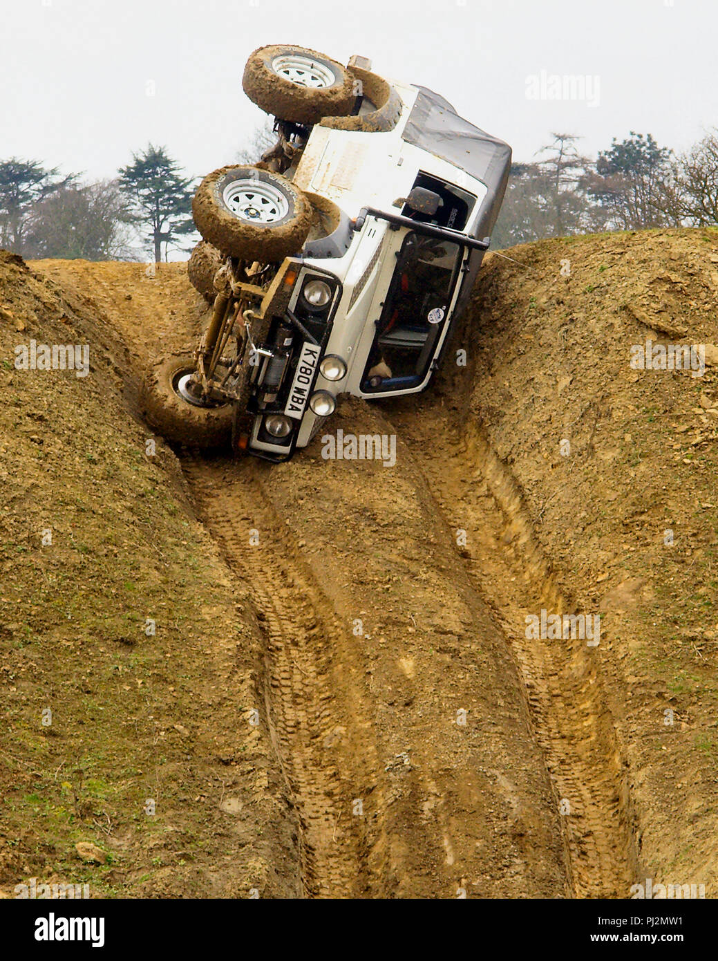 4X4 car overturned on muddy off-road track Stock Photo - Alamy
