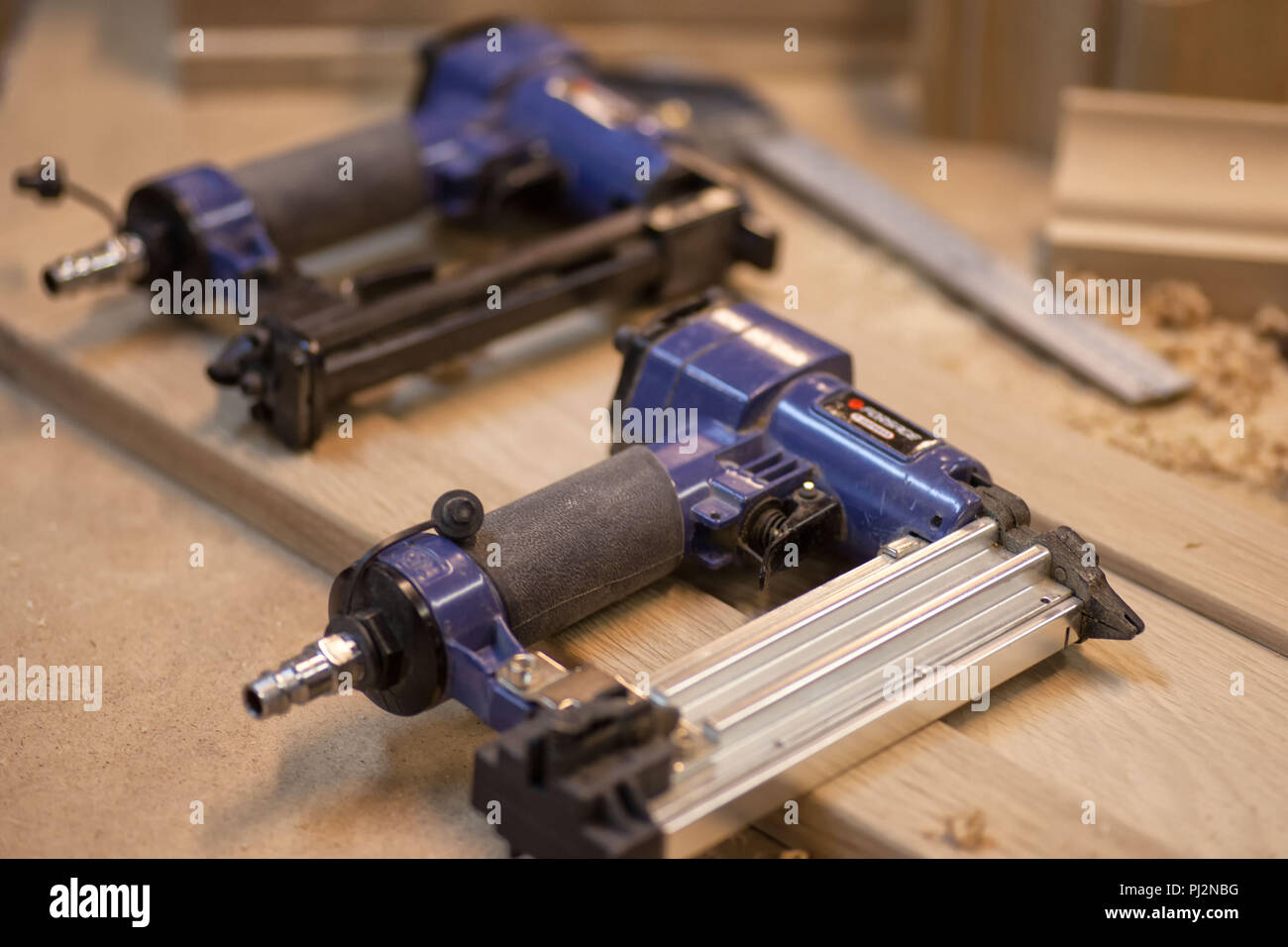 Manual manufacturing of furniture from a natural tree in a workshop ...