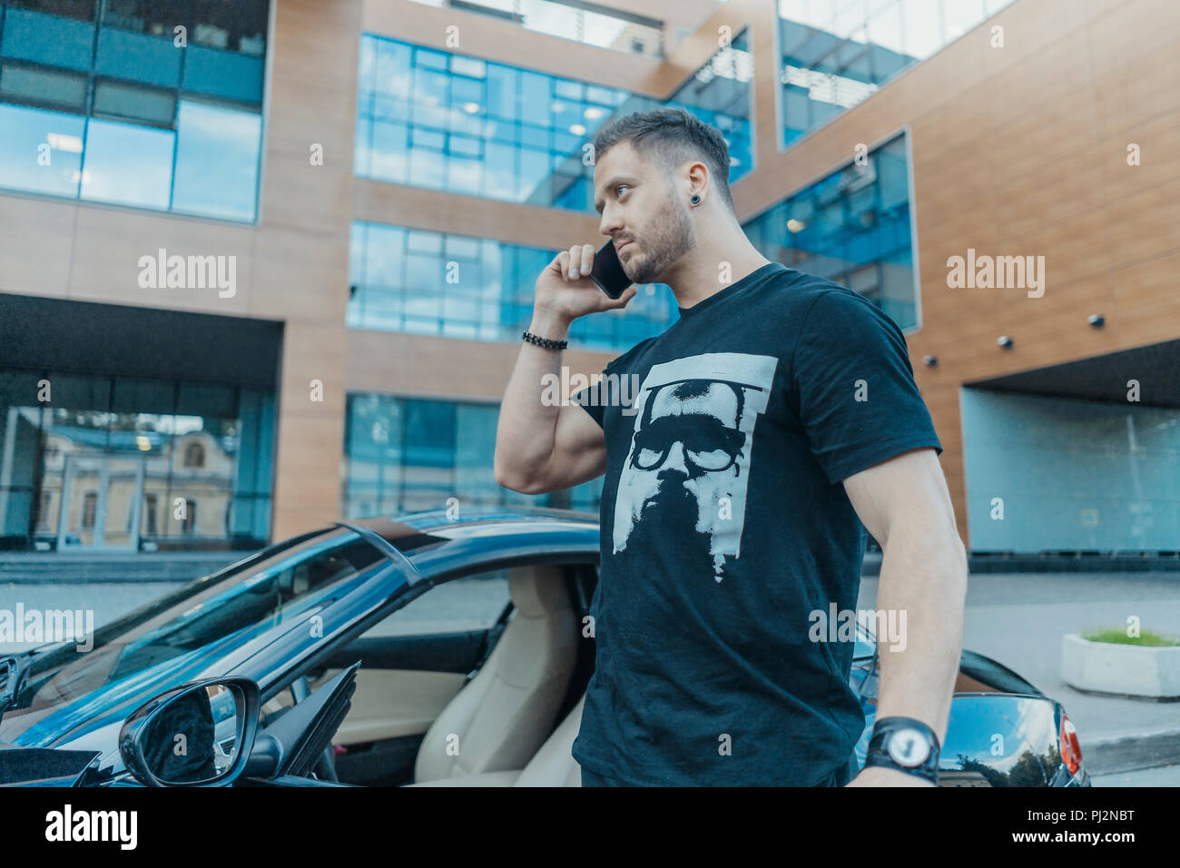 Businessman getting out of car hi-res stock photography and images - Alamy