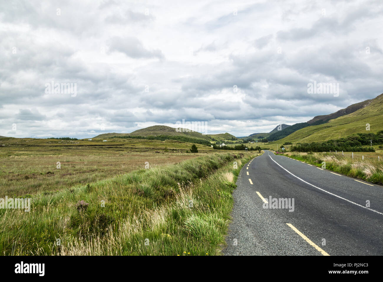This is a picture of a rural country road through the Irish mountains ...