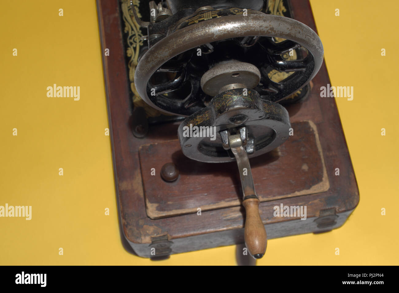 old sewing machine rear rotating mechanism close-up. Graceful wheel and ...