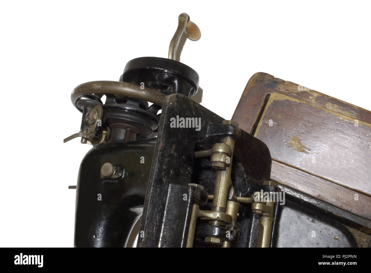 antique sewing machine with hand crank. Bottom mechanism, hidden in the ...
