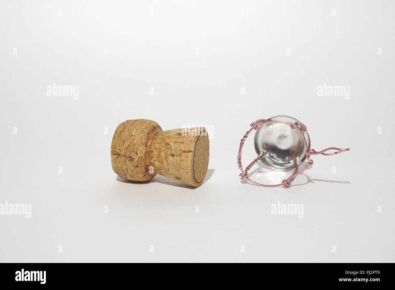 wooden cork and muselet of expensive sparkling wine. bottoms of the ...