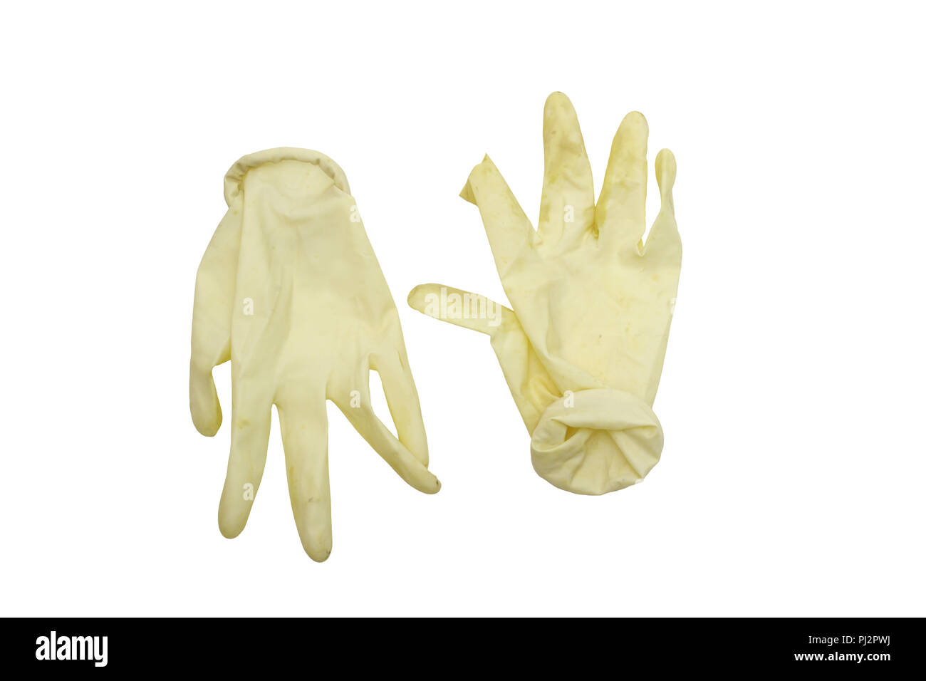 disposable surgical gloves, removed from hands. cuff is twisted, rubber ...