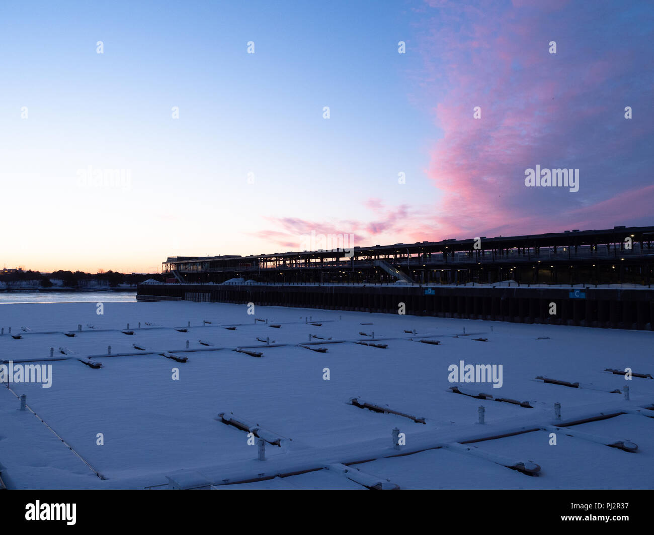 Snow covered docks at the marina at Old Port or Vieux Port on the St ...