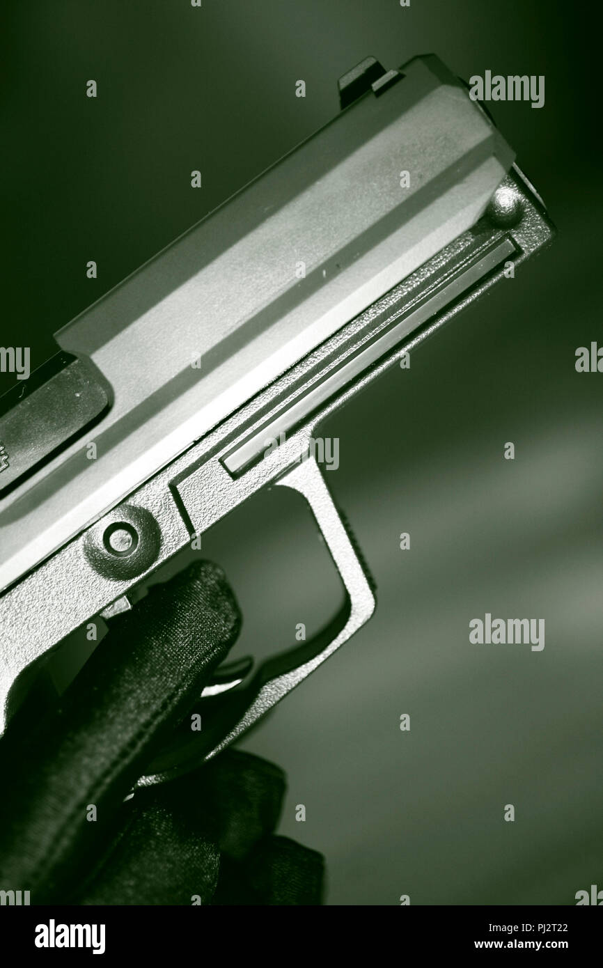 Pistol automatic handgun weapon on table in hotel bedroom in ...