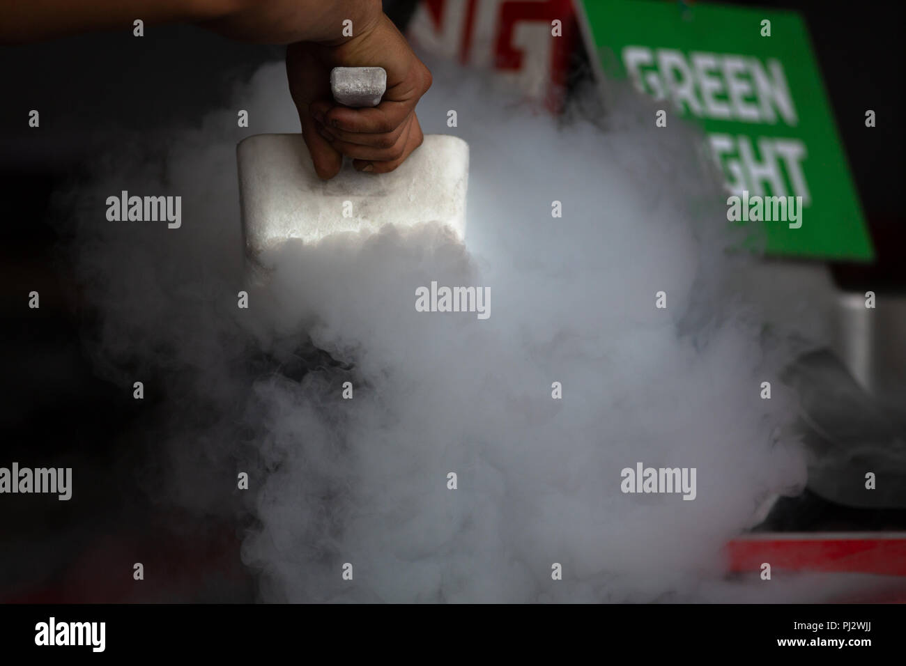 Dry ice being scooped into a Formula E car for cooling - Brooklyn, New ...