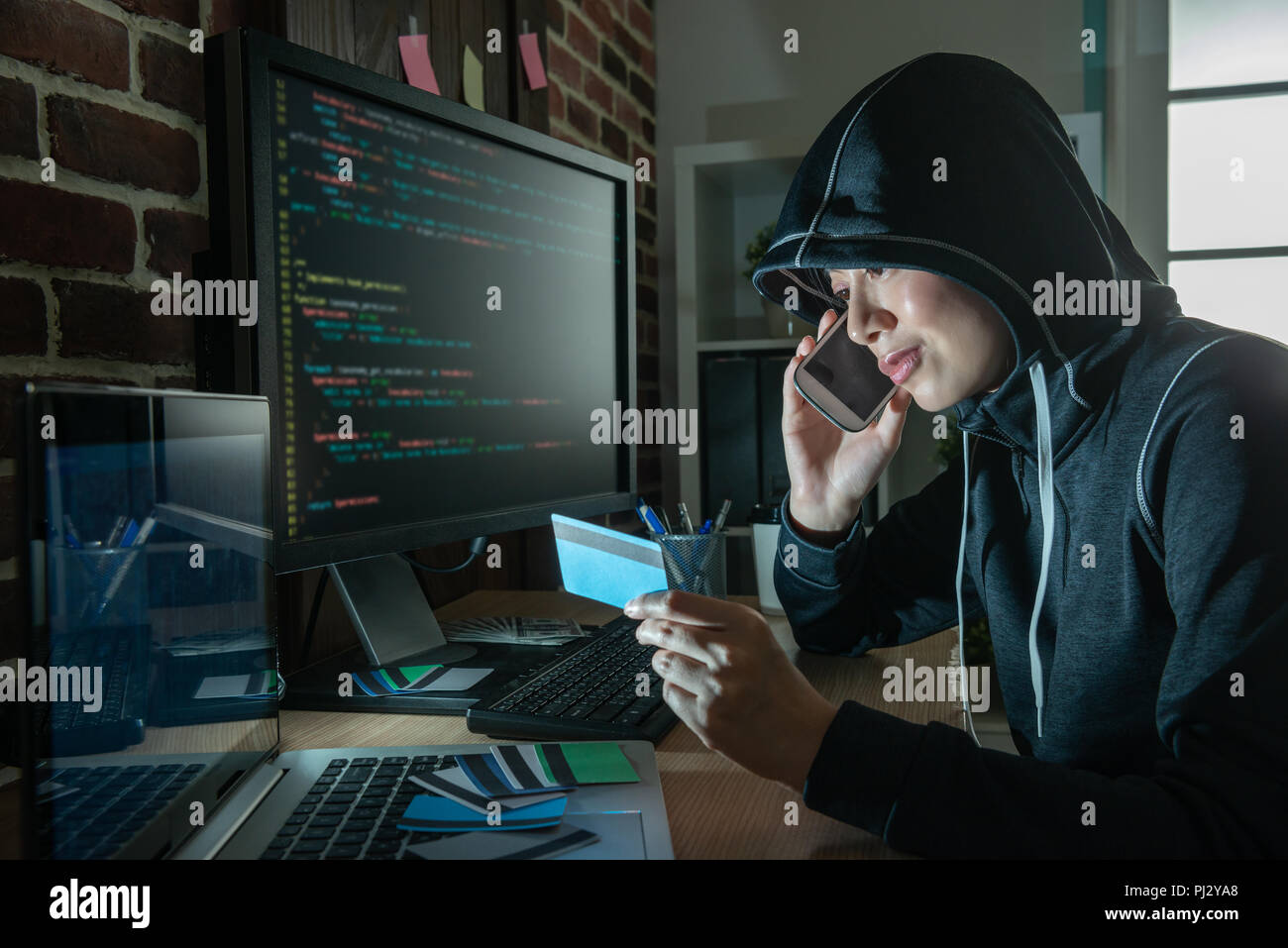 female hacker threating victim by smarphone. hacking from system error ...