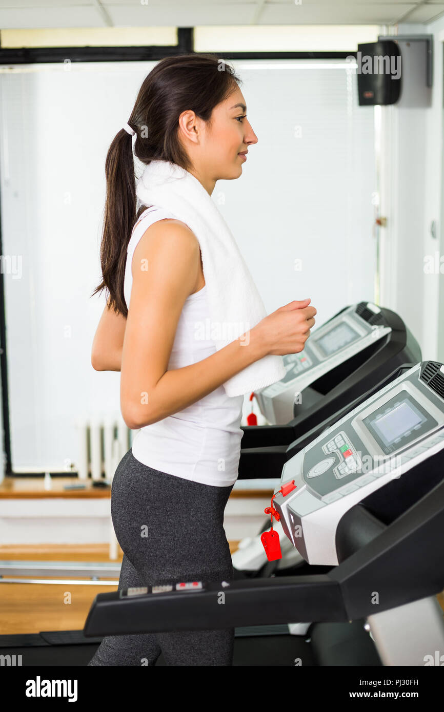 Fitness woman exercising on treadmill at the gym Stock Photo - Alamy