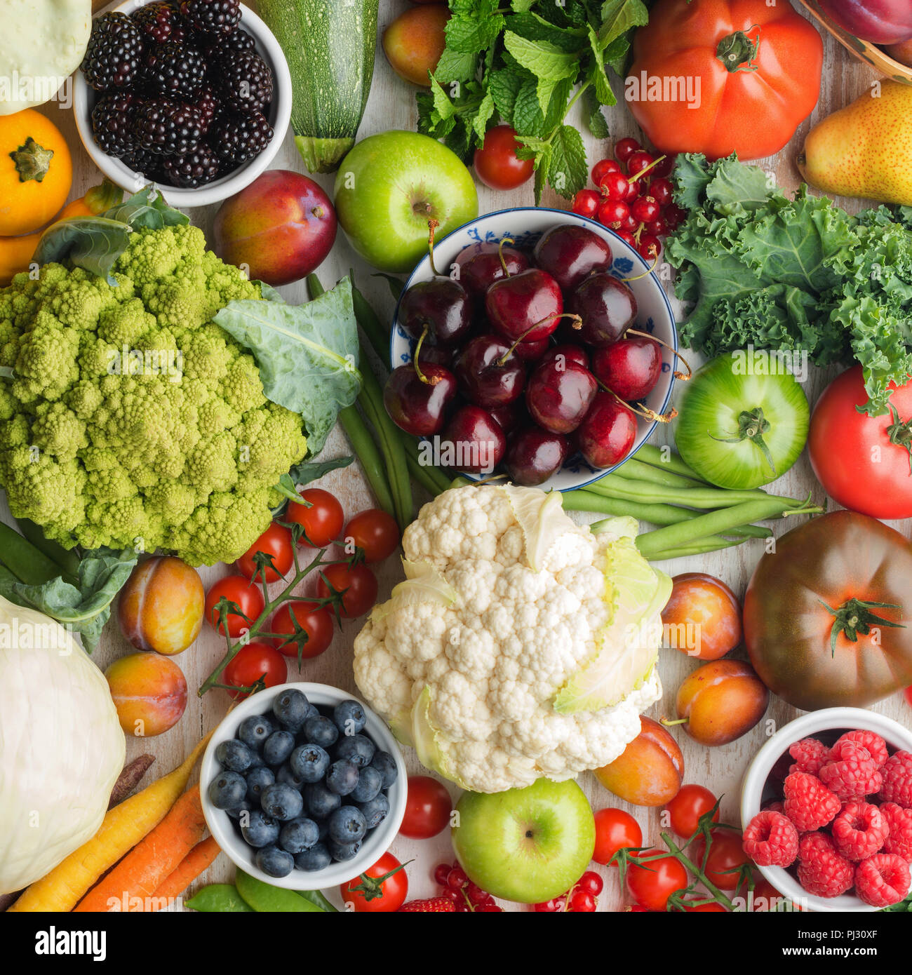 Assortment of healthy fruits vegetables berries, cherries cabbage ...