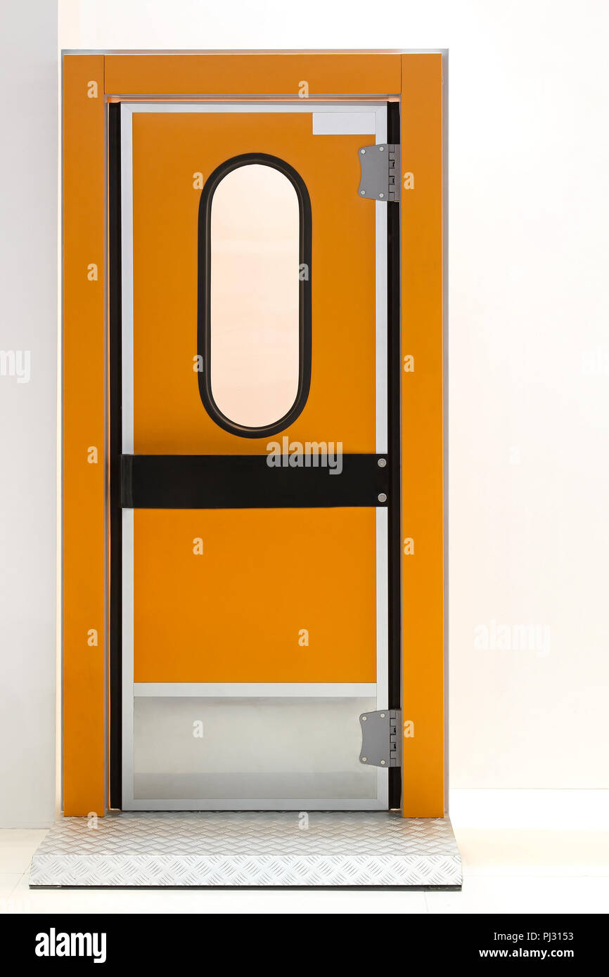 Orange insulated door at industrial fridge reefer Stock Photo - Alamy