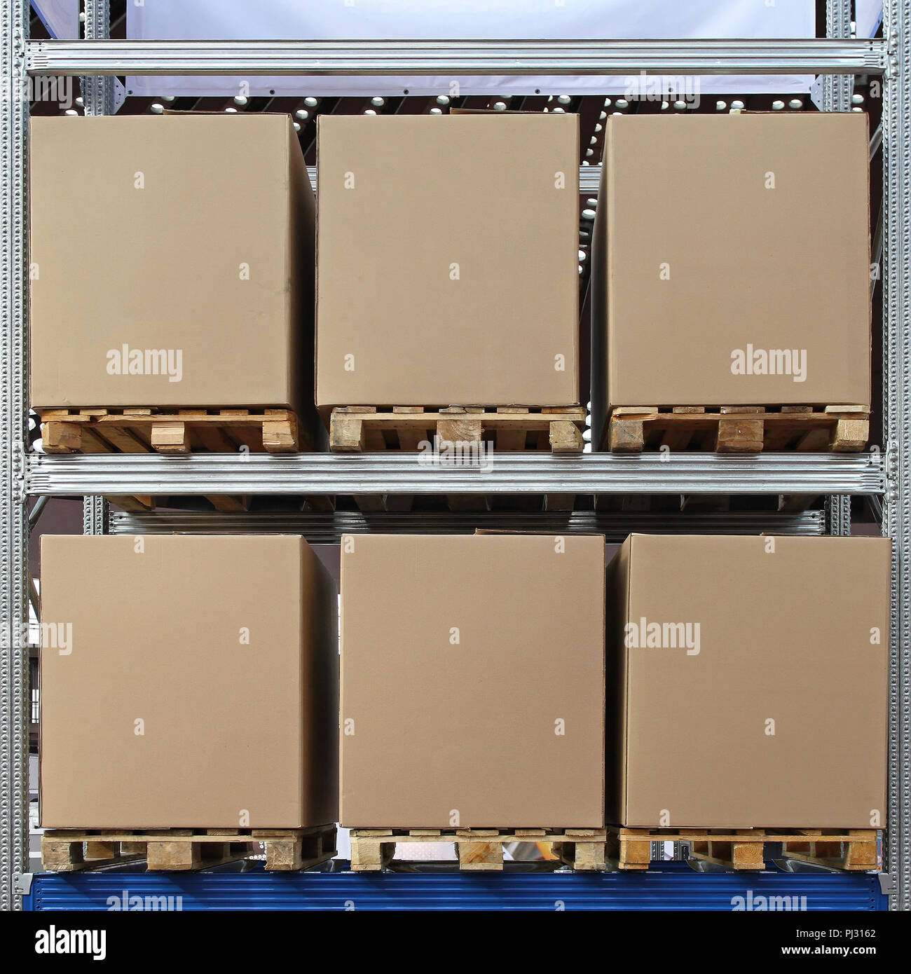 Six carboard boxes at pallets in distribution warehouse Stock Photo - Alamy