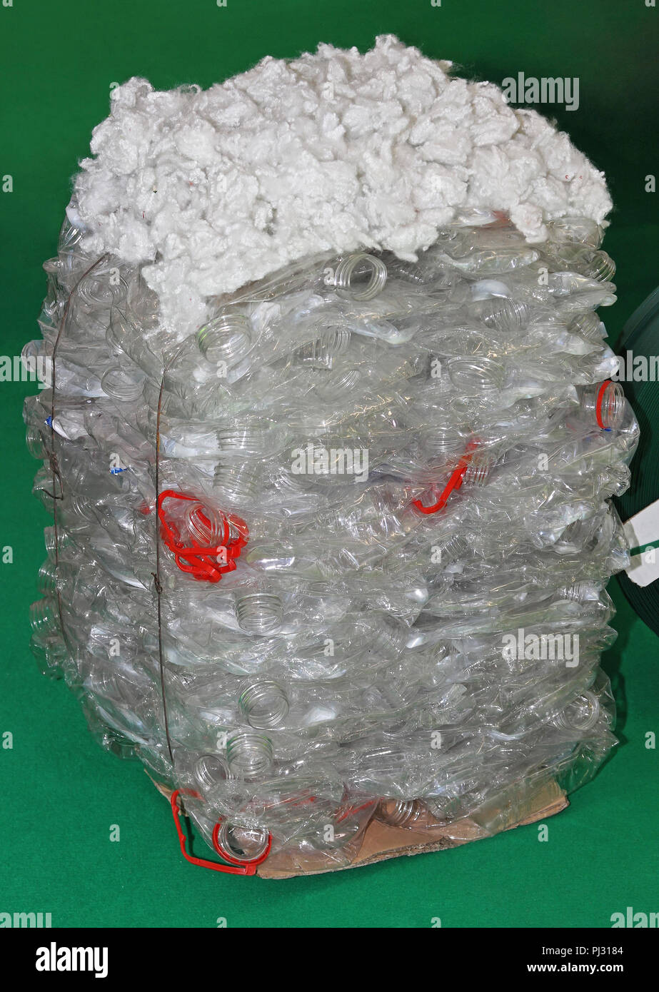 Crushed clear plastic bottles compacted in bale Stock Photo - Alamy